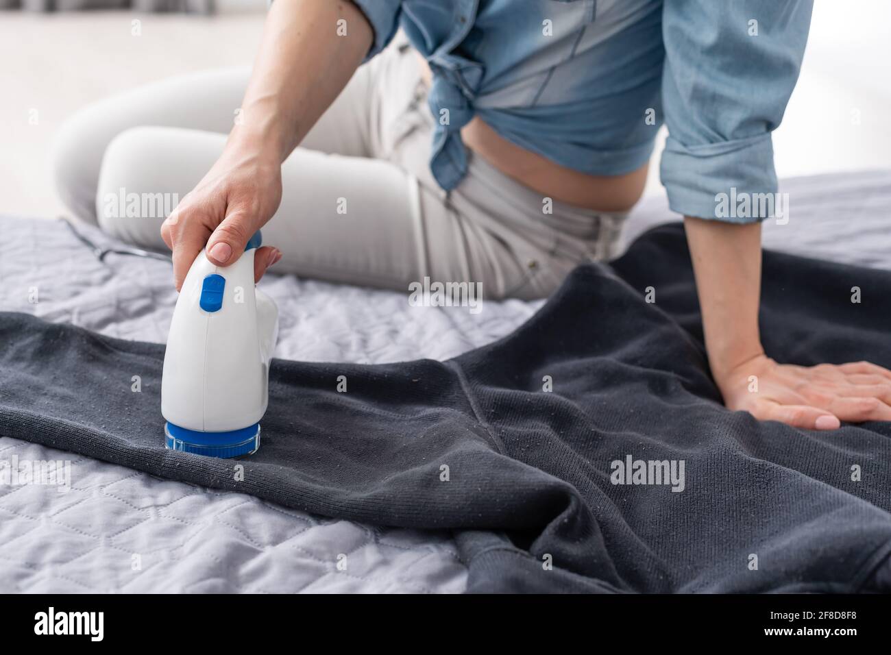 Woman Removing Clothes High Resolution Stock Photography and Images - Alamy