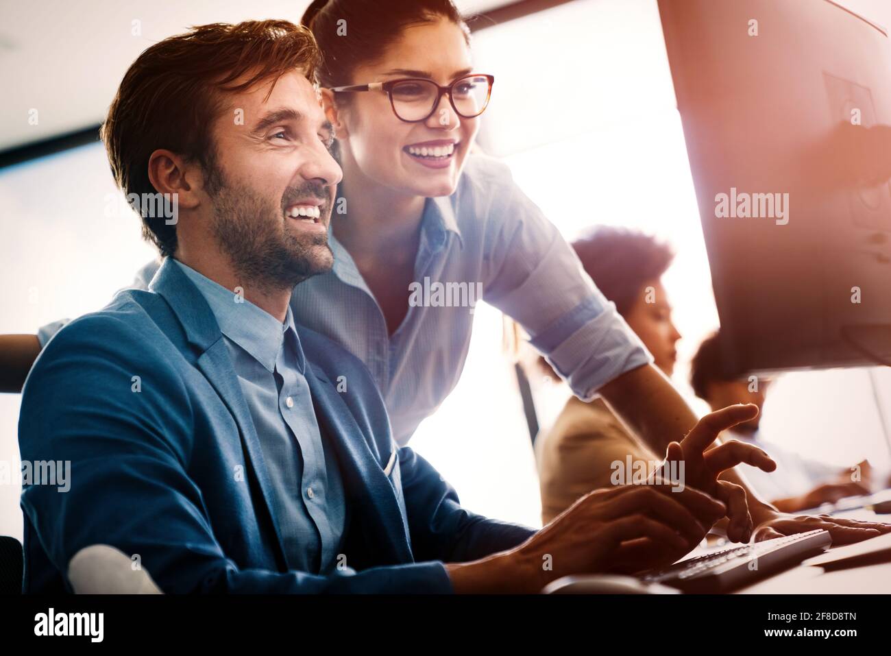 Happy business people having fun and chatting at workplace office Stock ...