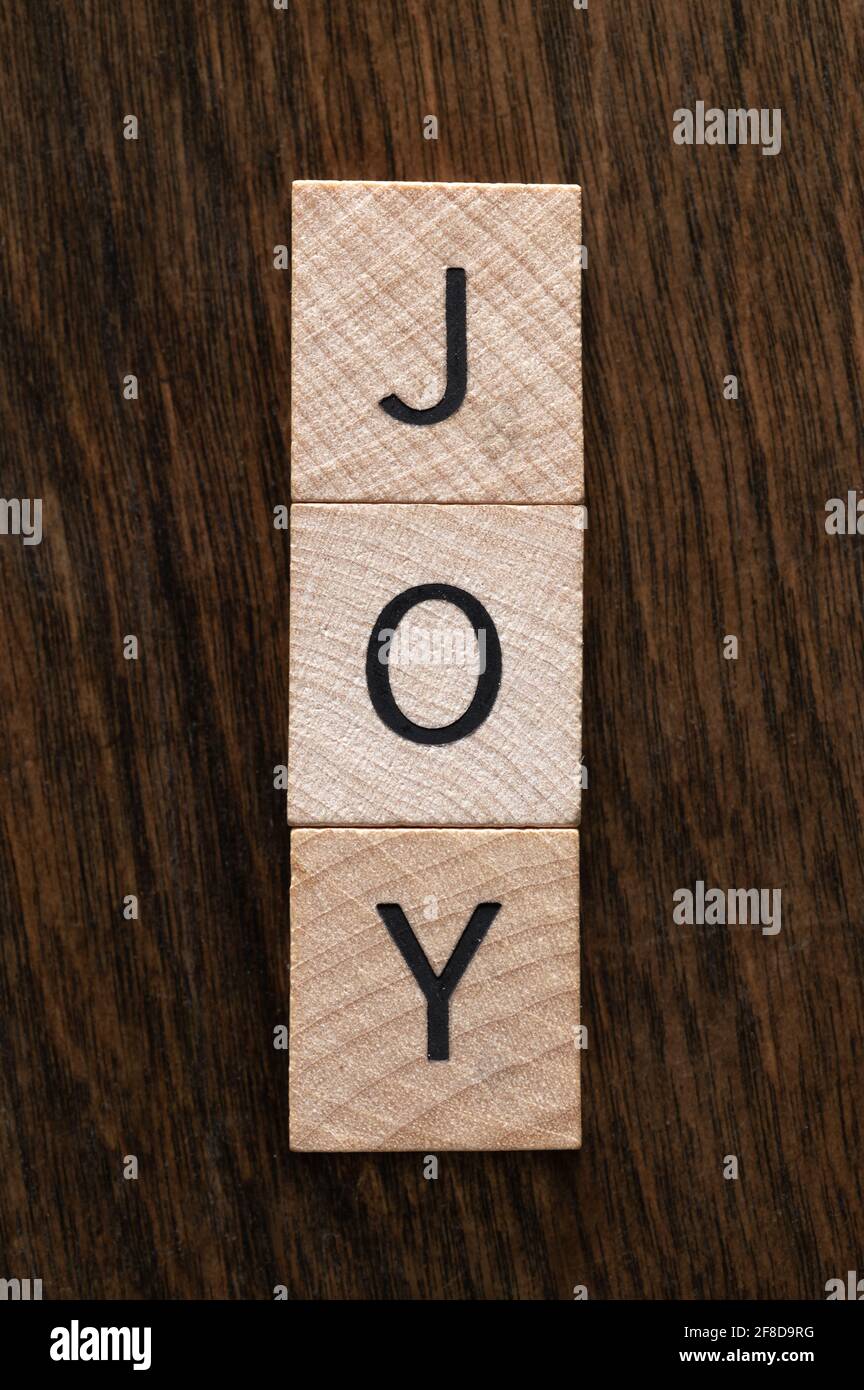 Top View of Wood Tiles Spelling "Joy", Vertical Stock Photo - Alamy