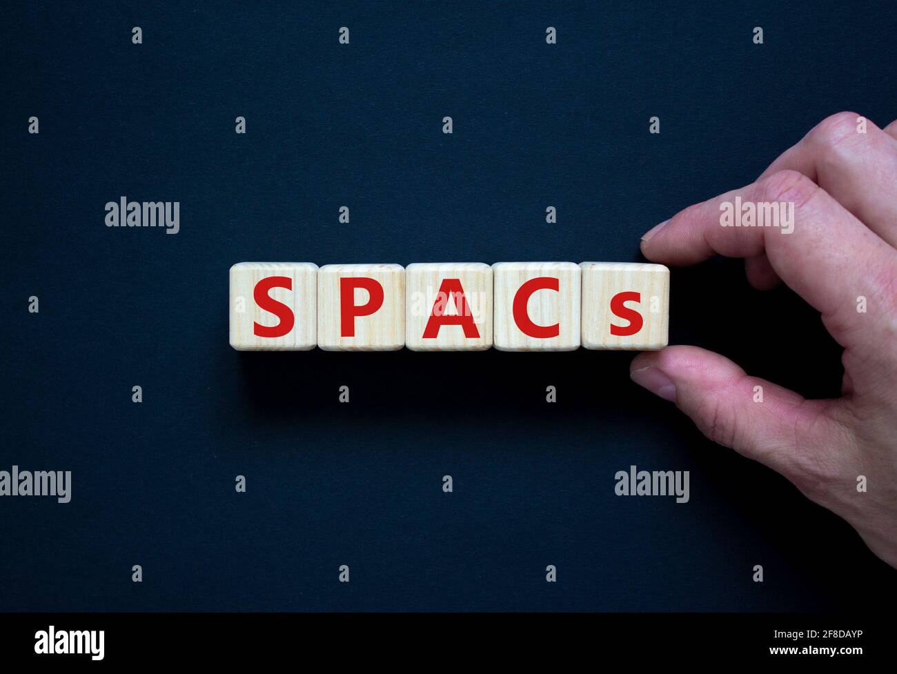 SPACs symbol. Wooden cubes with words 'SPACs, special purpose ...