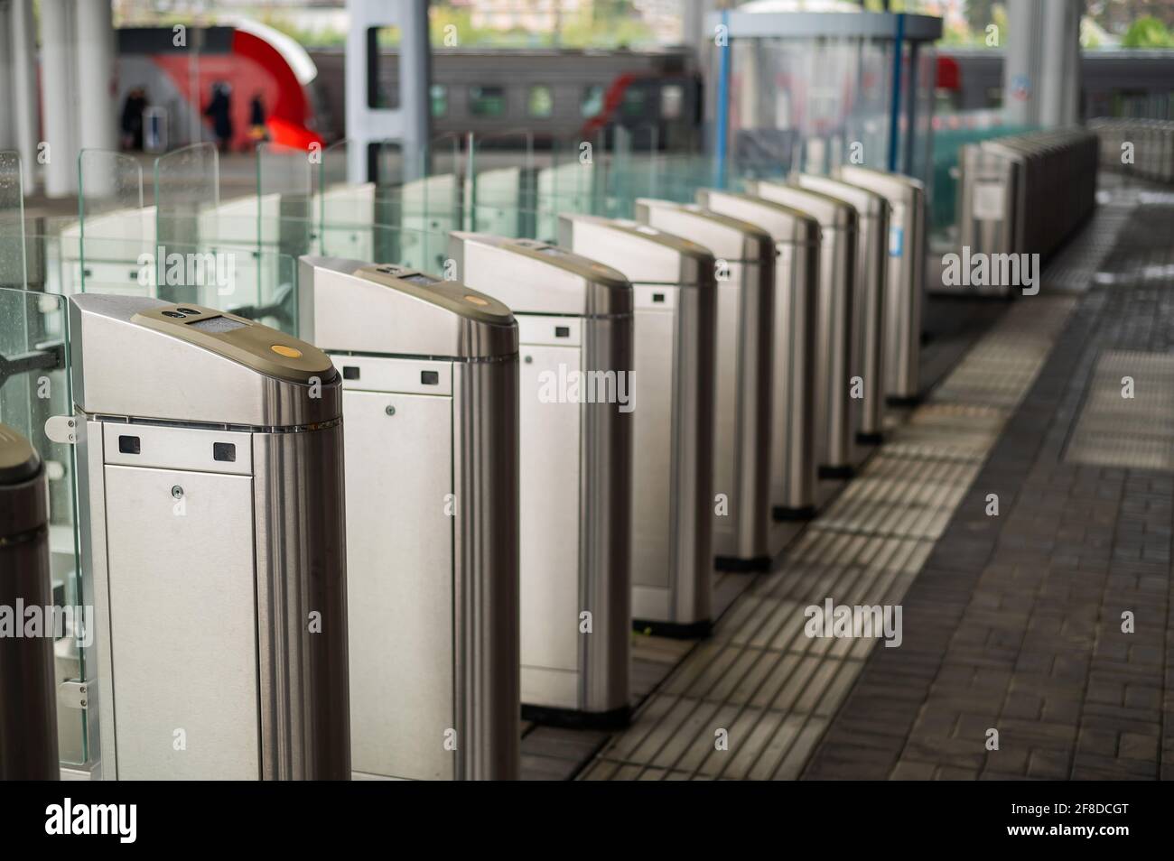 Empty turnstiles at a railway station Stock Photo - Alamy