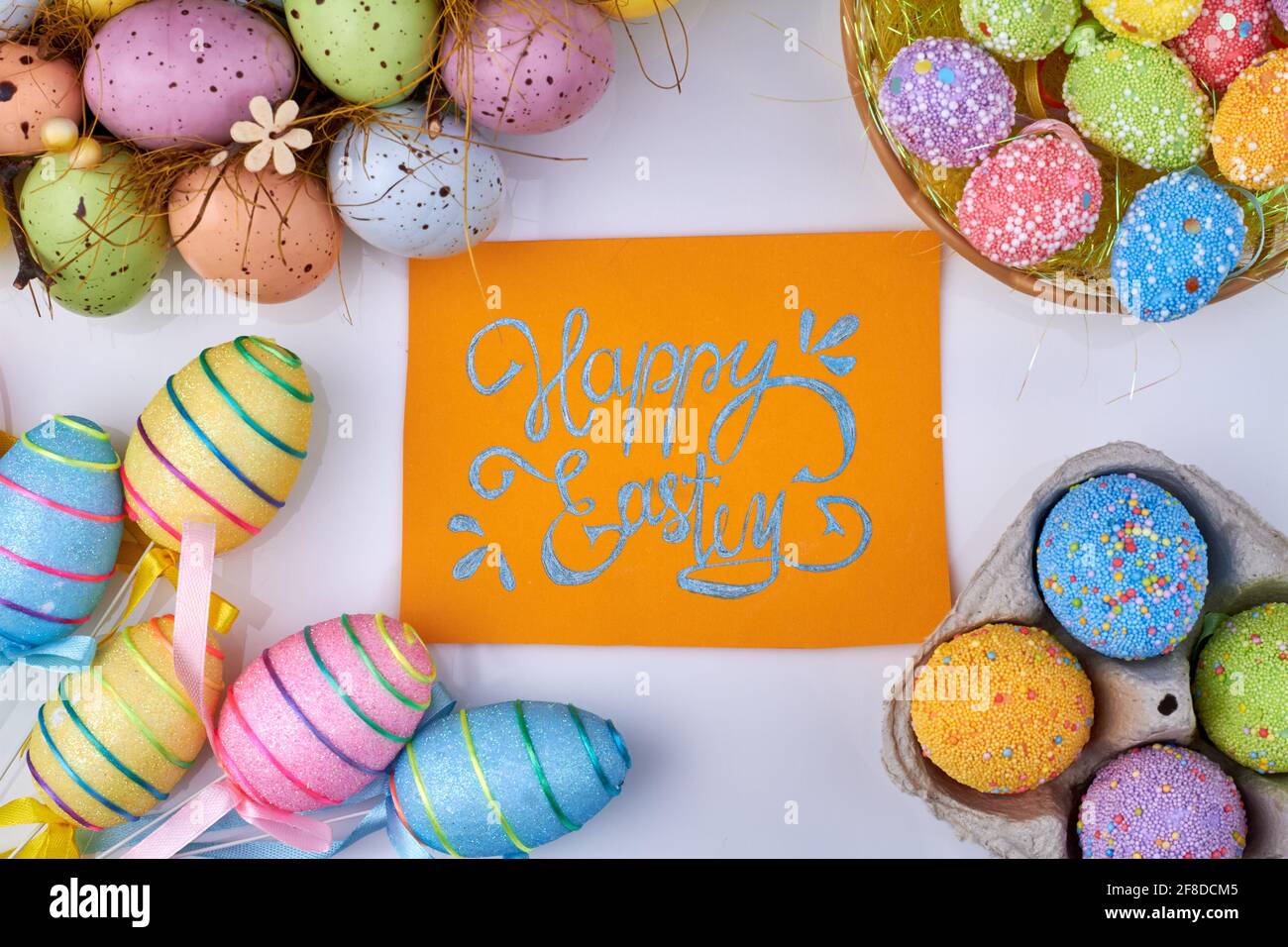 Happy easter congratulation. Colored easter eggs on white background ...