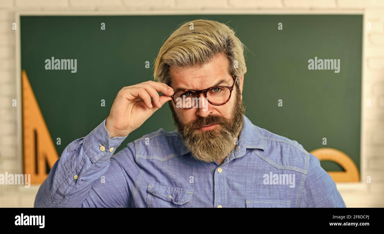 elementary mathematics. strict teacher in glasses. teacher check ...