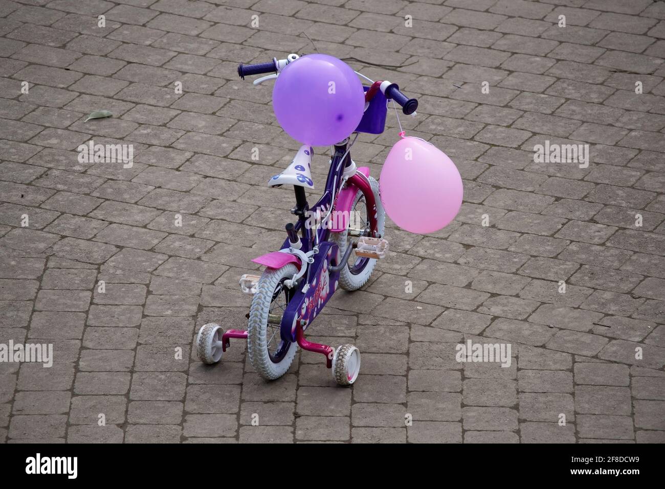 Balloons on cycle hi-res stock photography and images - Alamy