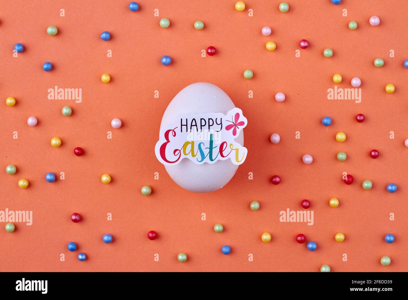 Chicken egg with happy easter wish Stock Photo - Alamy