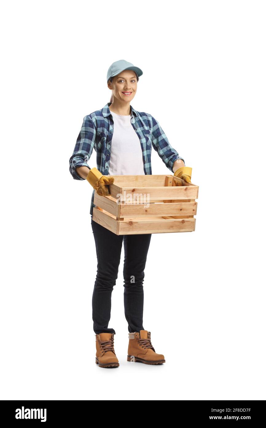 Full length portrait of a female farmer worker carrying an empty crate ...