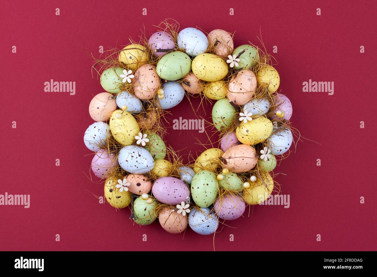 Easter eggs circle on dark red background Stock Photo - Alamy