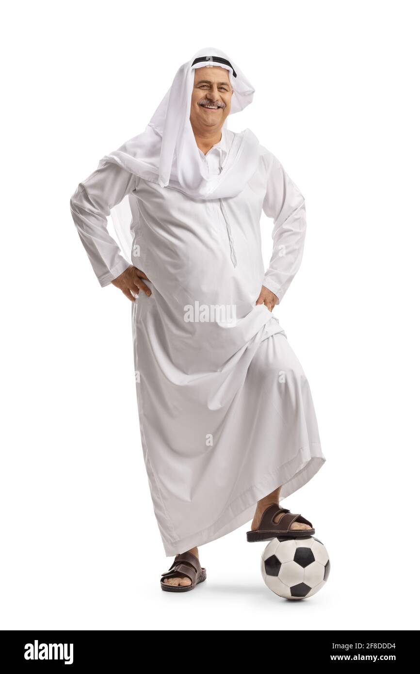 Full length portrait of a mature arab man in a thobe with a soccer ball ...