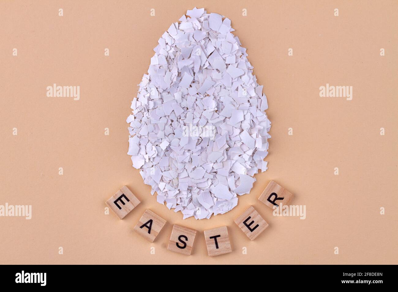 Huge egg made of broken eggshell pieces Stock Photo - Alamy