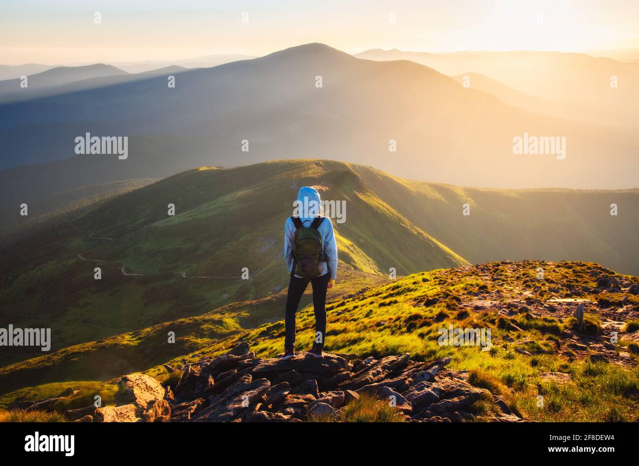 Girl on mountain peak with looking at beautiful mountain valley Stock ...