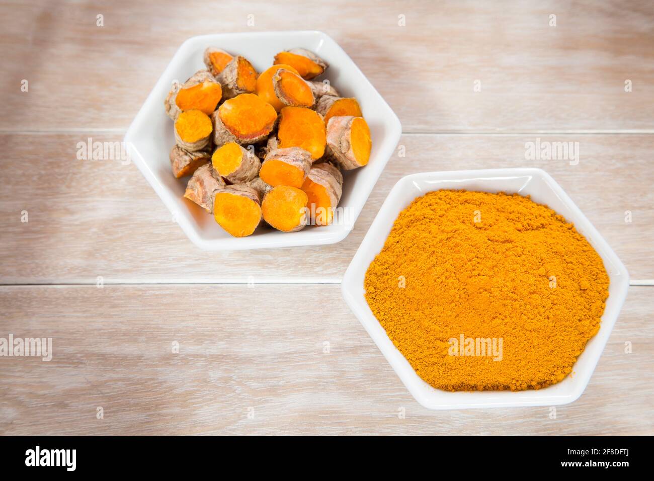 Turmeric powder and fresh turmeric - Curcuma longa Stock Photo - Alamy