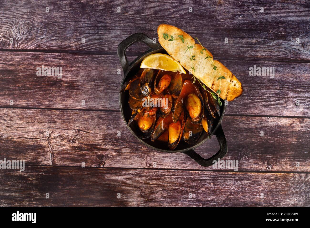 Traditional French Corsican mussel stew with mussels as top view in a ...