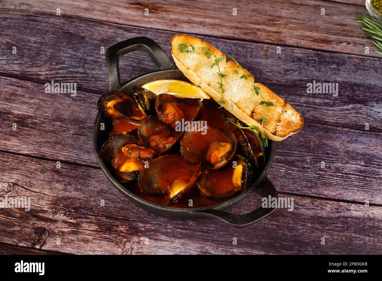 Traditional French Corsican mussel stew with mussels as top view in a ...