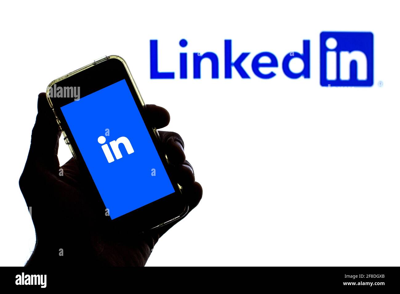 In this photo illustration the LinkedIn app seen displayed on a ...