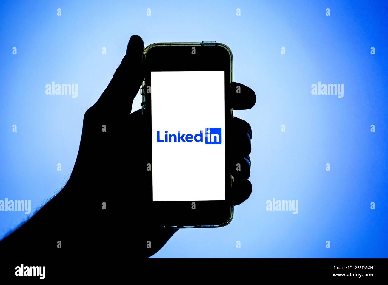 In this photo illustration the LinkedIn logo seen displayed on a ...