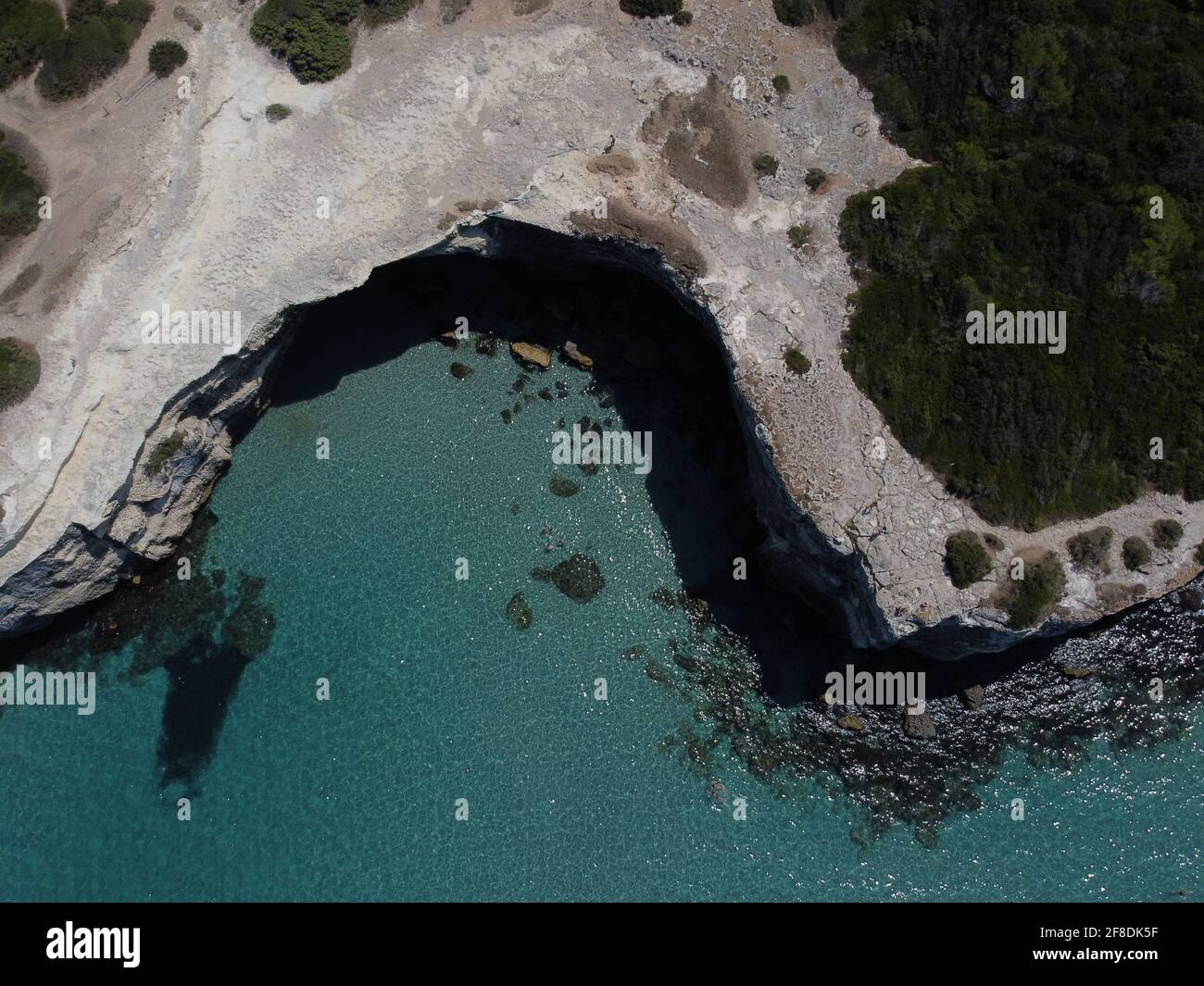 Aerial top view of mesmerizing ocean waters separated by coastal ...