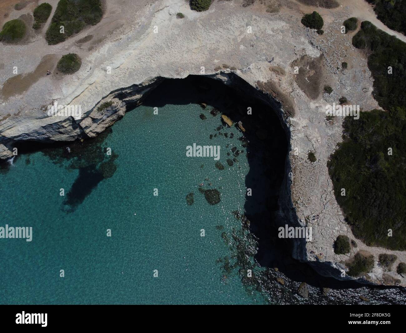Aerial top view of mesmerizing ocean waters separated by coastal ...