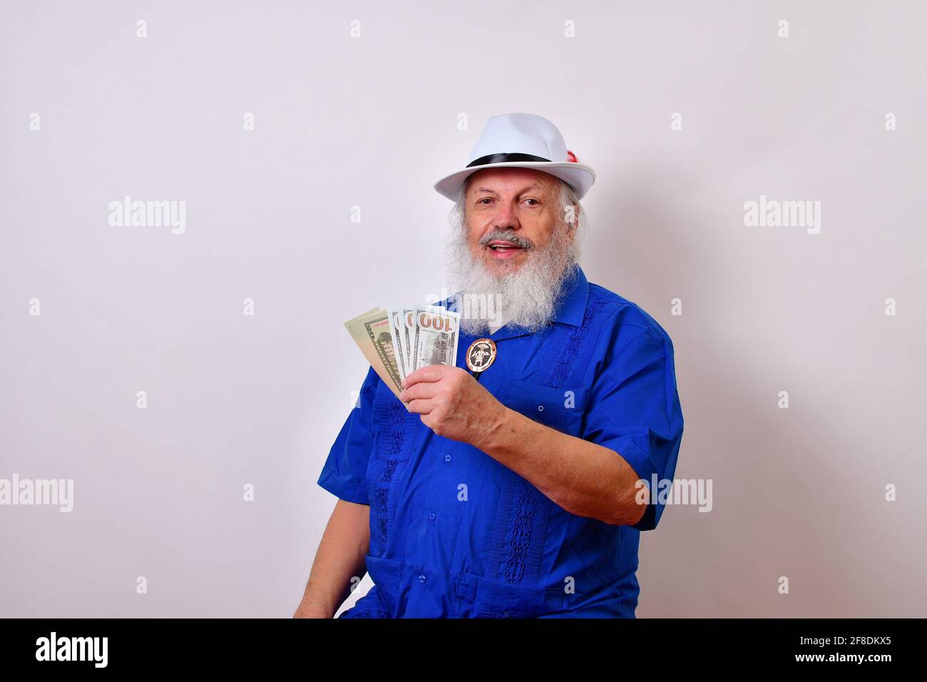 A proud old man holding a handful of paper money Stock Photo - Alamy