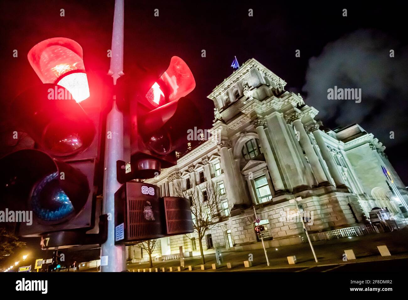 Berlin, Germany. 13th Apr, 2021. A red traffic light shines in front of ...