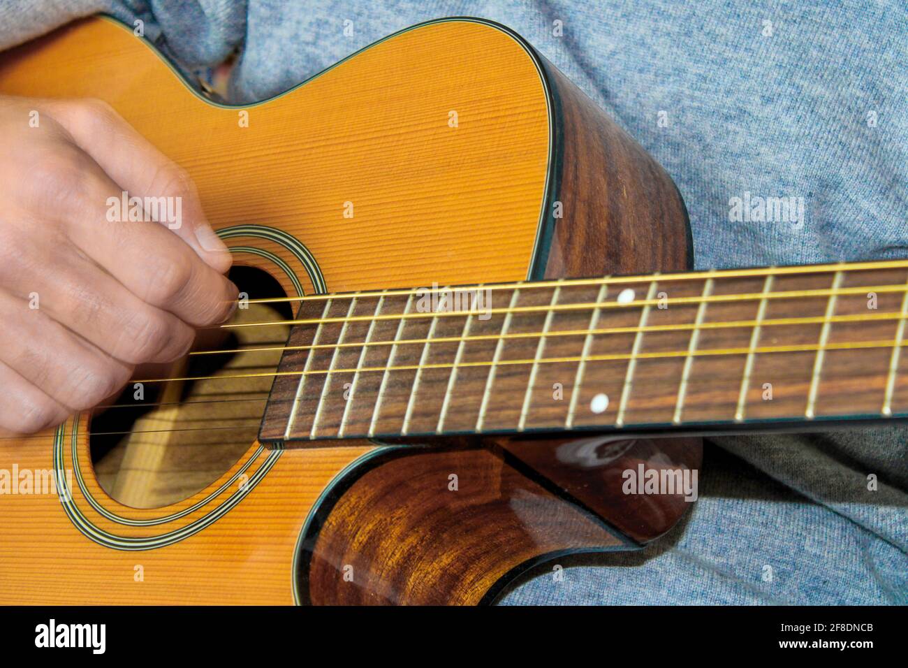 Male Right Hand Strumming on a Steel String Acoustic Guitar Stock Photo ...