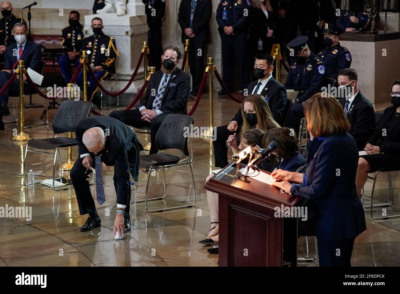 United States President Joseph R. Biden Jr. picks up a Capitol doom ...