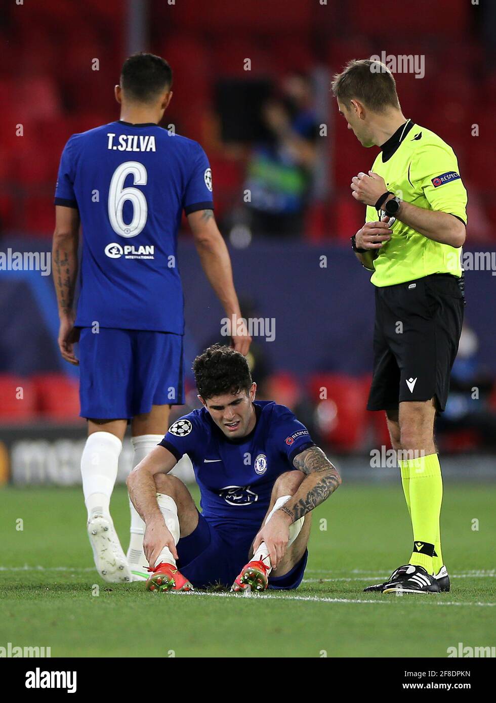 Referee Clement Turpin (right) looks on after Chelsea's Christian ...