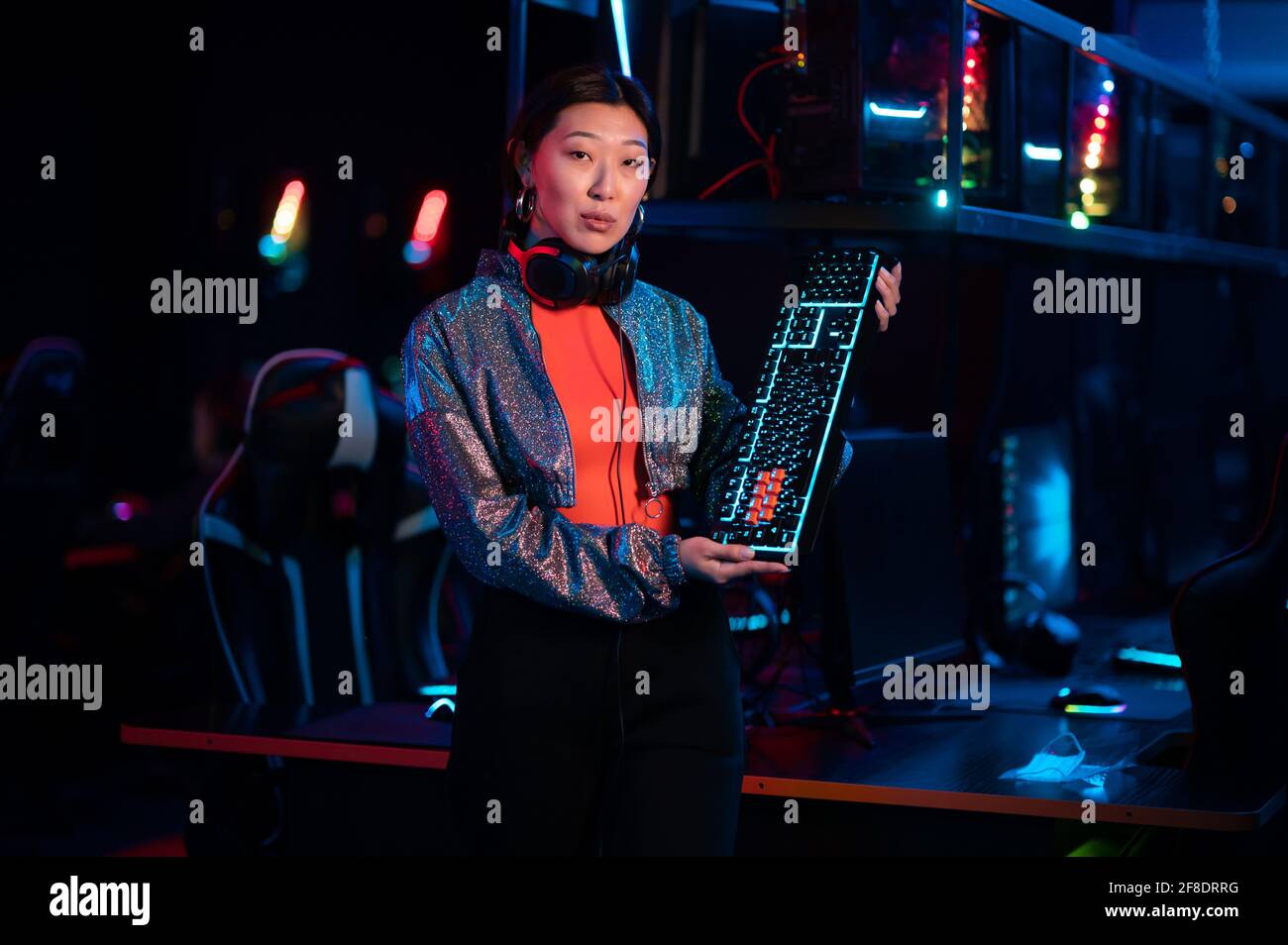A cute female gamer from the chinese women's esports team poses with a ...