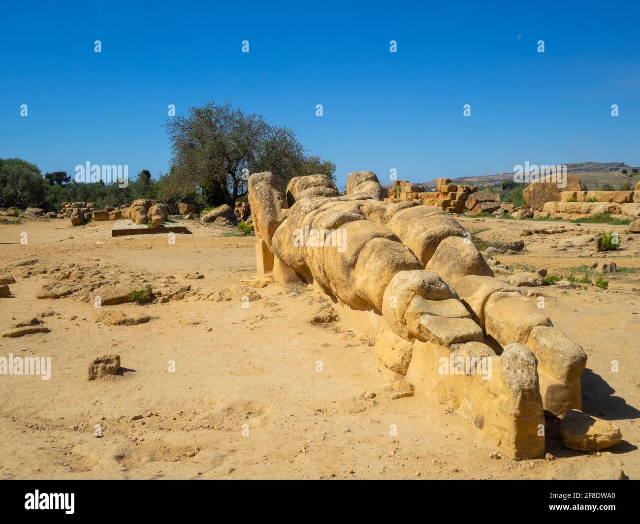 An atlas remains from the Temple of the Olympian Zeus stand on the ...