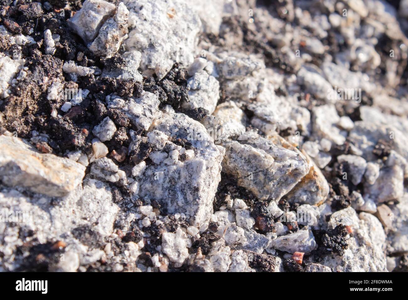 close-up of Old cracked asphalt pavement. concept of reduce reuse ...