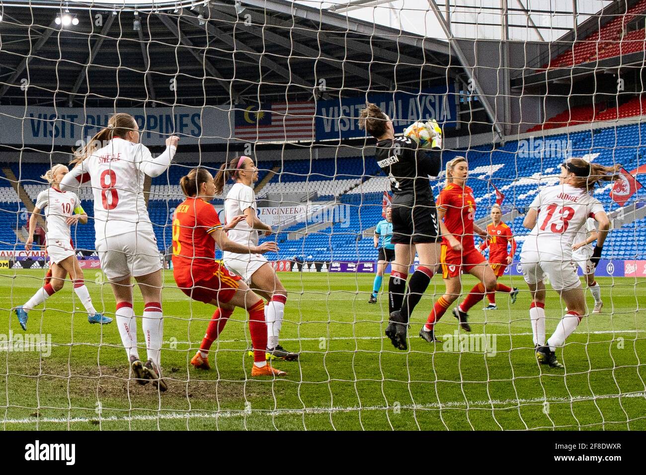 Denmark goalkeeper Lene Christensen claims the ball from a corner Wales ...