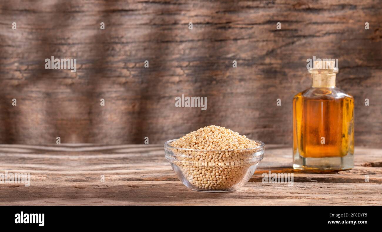 White millet seeds with oil bottle - Healthy food Stock Photo - Alamy