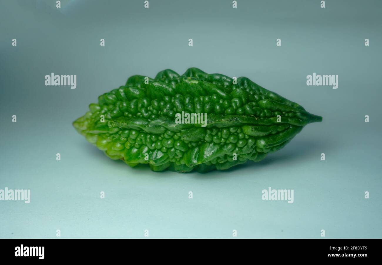 Fresh bitter melon on white. Healthy bitter melon for human body Stock ...