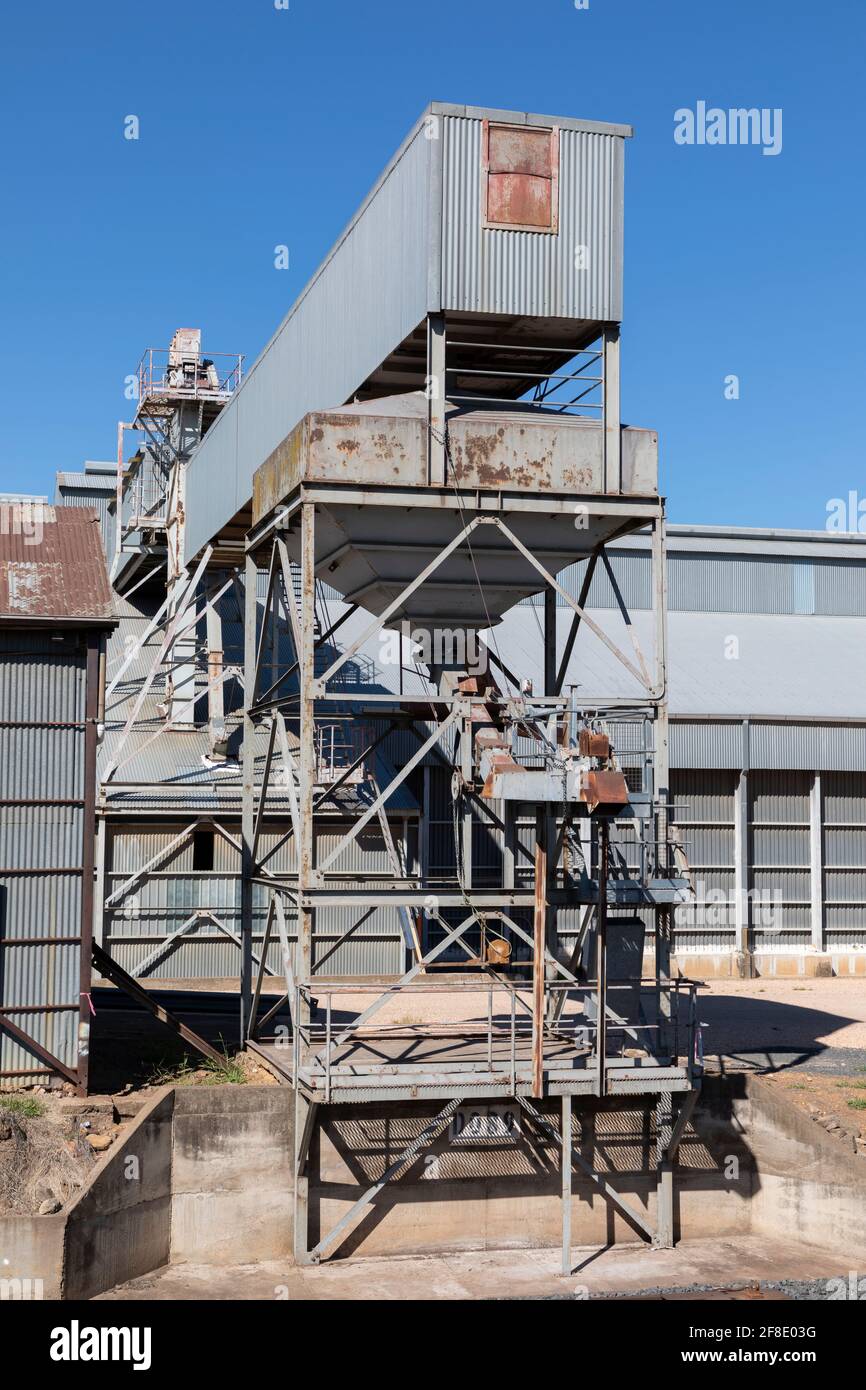 An old and rusty train loading conveyor system at a large flour mill ...