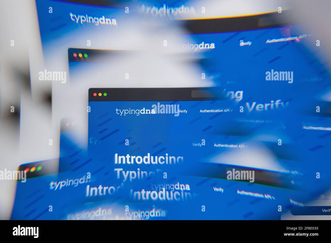Milan, Italy - APRIL 10, 2021: TypingDNA logo on laptop screen seen through an optical prism ...