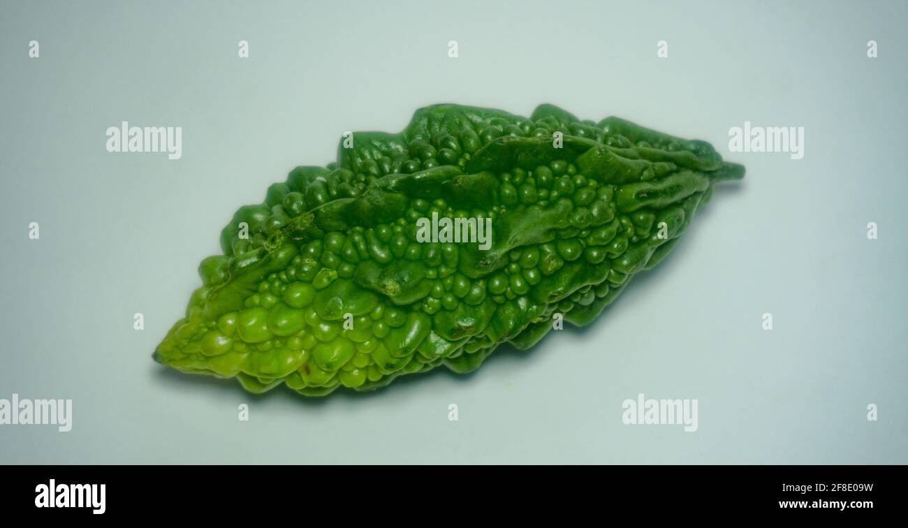 Fresh bitter melon on white. Healthy bitter melon for human body Stock ...