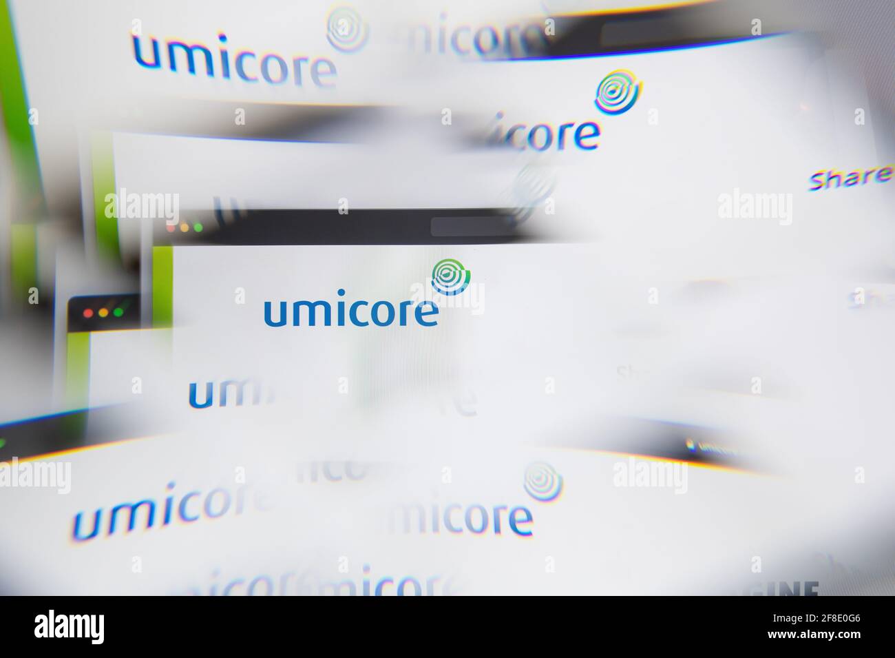 Milan, Italy - APRIL 10, 2021: Umicore logo on laptop screen seen through an optical prism ...