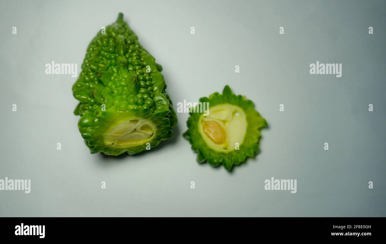 Fresh bitter melon on white. Healthy bitter melon for human body Stock ...