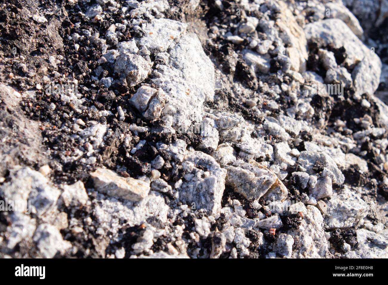 close-up of Old cracked asphalt pavement. concept of reduce reuse ...