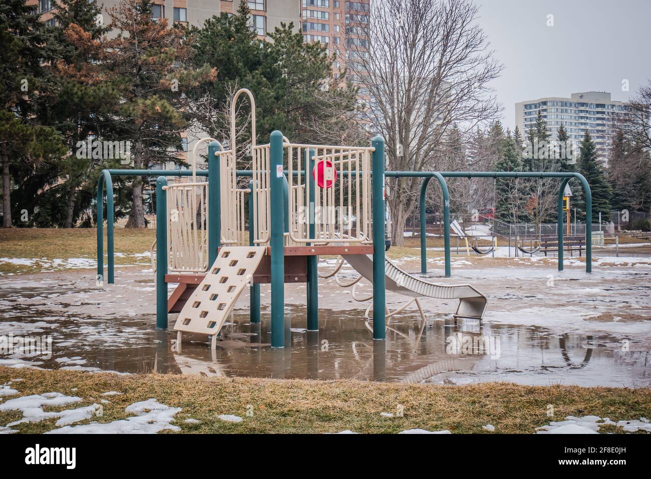flooded playground due to melted snow after winter Stock Photo - Alamy