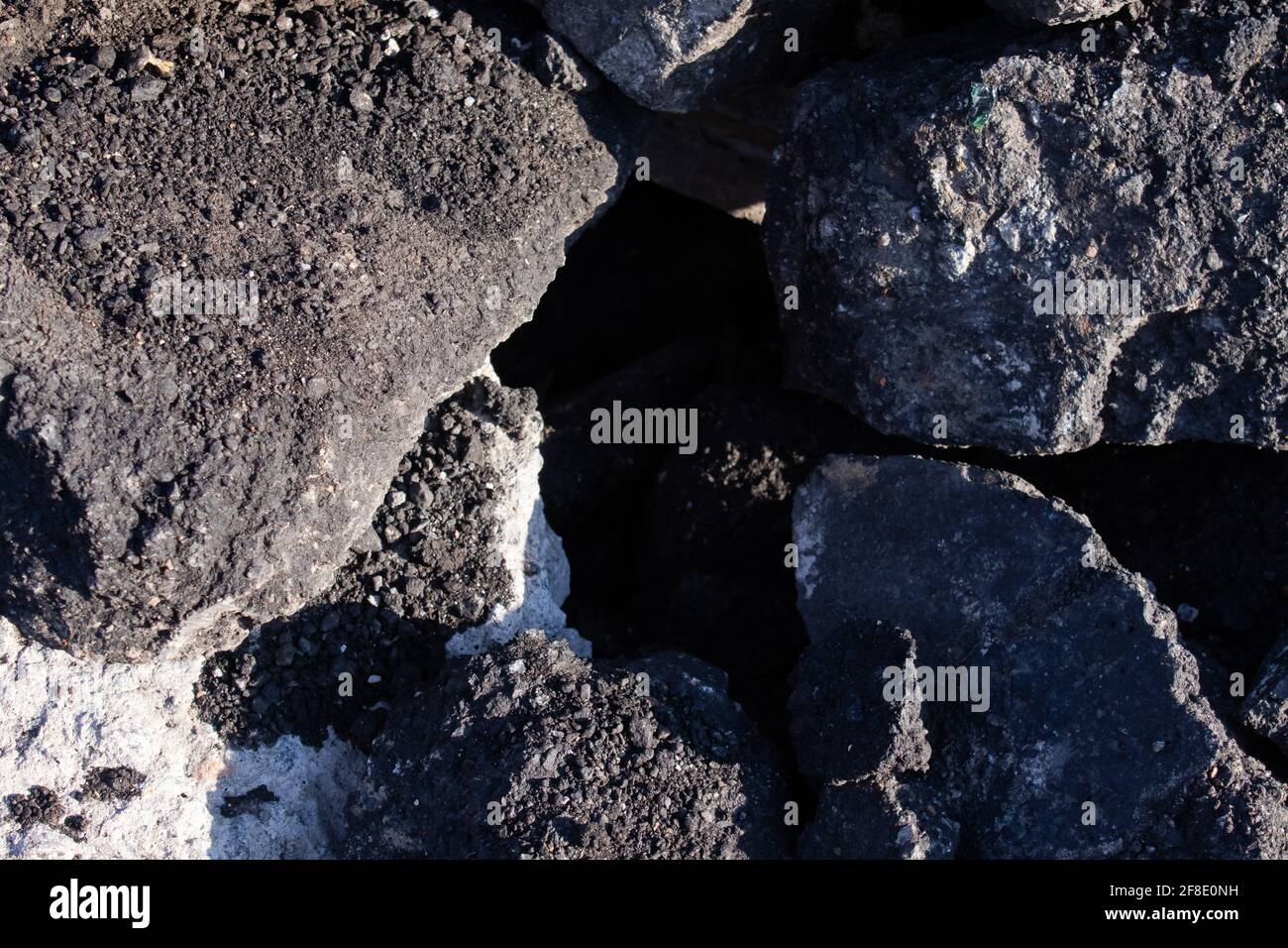 close-up of Old cracked asphalt pavement. concept of reduce reuse ...