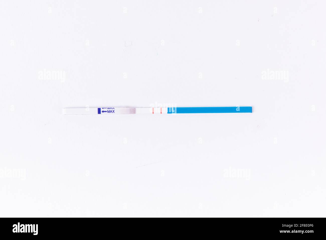 Isolated shot of positive pregnancy test kit on a white background ...