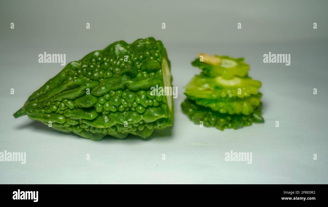 Fresh bitter melon on white. Healthy bitter melon for human body Stock ...