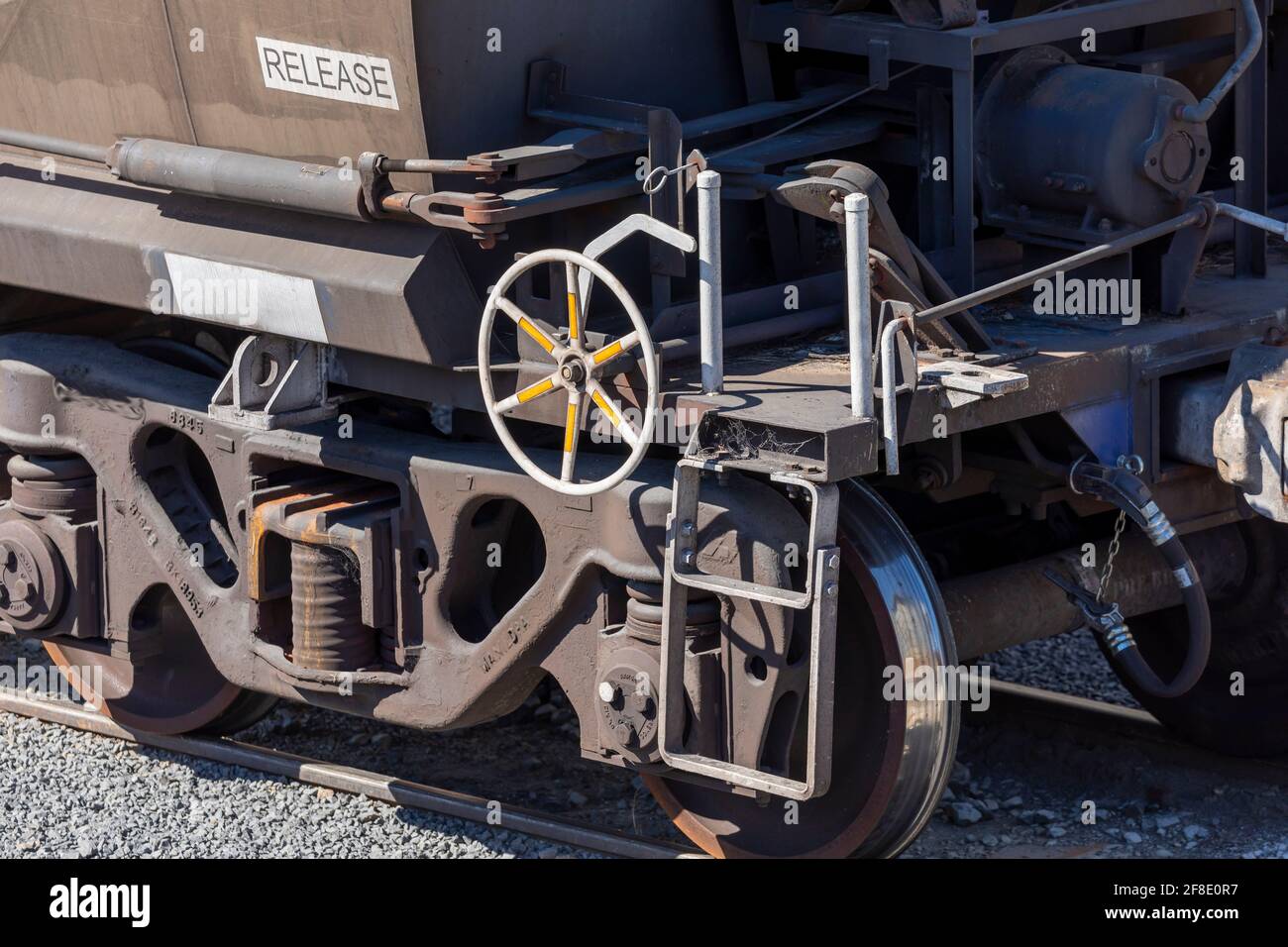 Train wheels and tank on a freight train in a production facility ...
