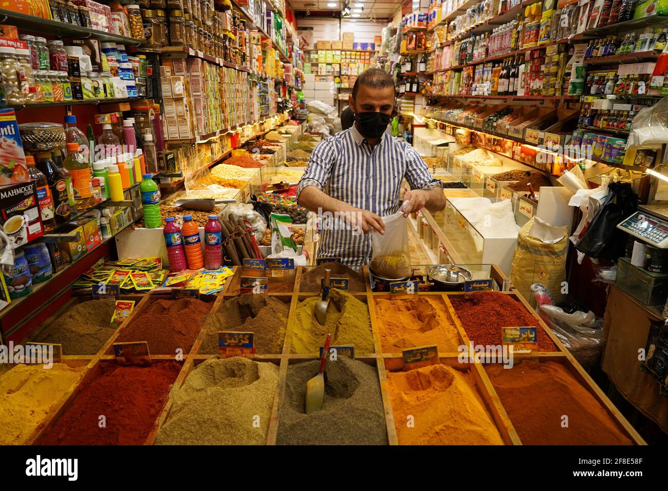 Duhok, Iraq. 13th Apr, 2021. An Iraqi Kurdish man sells Spices on the ...