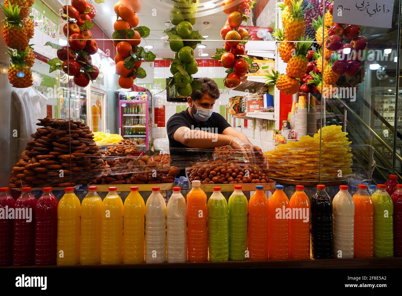 An Iraqi Kurdish man sells sweetmeats and juices on the first day of ...