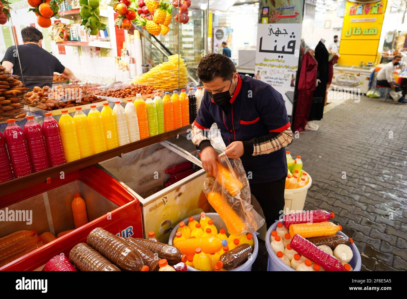 Duhok, Iraq. 13th Apr, 2021. An Iraqi Kurdish man sells juices on the ...