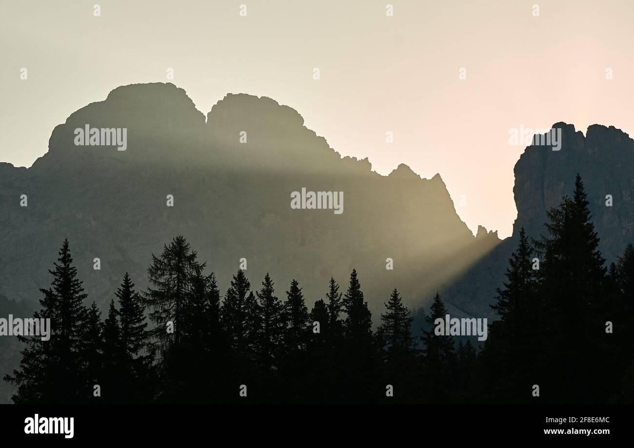 Sunrise between mountain cliffs Stock Photo - Alamy
