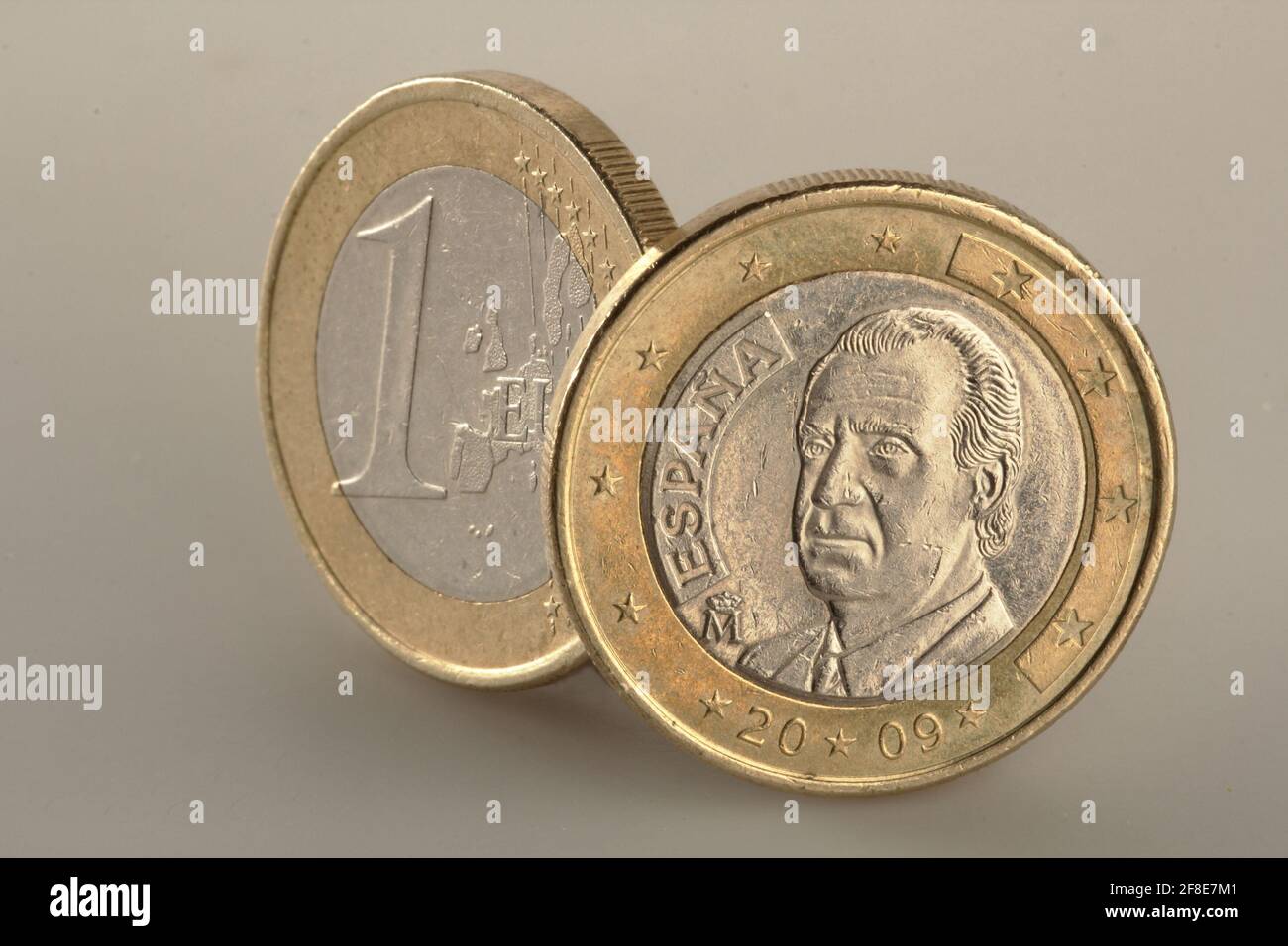 Closeup shot of Spanish coins on a plain background Stock Photo - Alamy