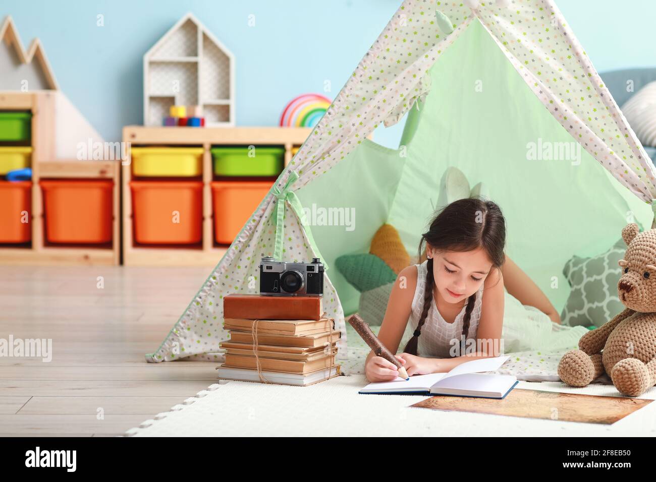 Cute little girl playing with treasure map at home Stock Photo - Alamy