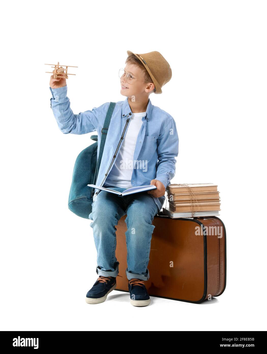 Cute little adventurer on white background Stock Photo - Alamy